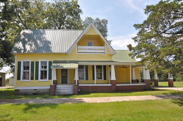 Arabi GA Yellow Clapboard Vernacular House with Inset Second Floor ...